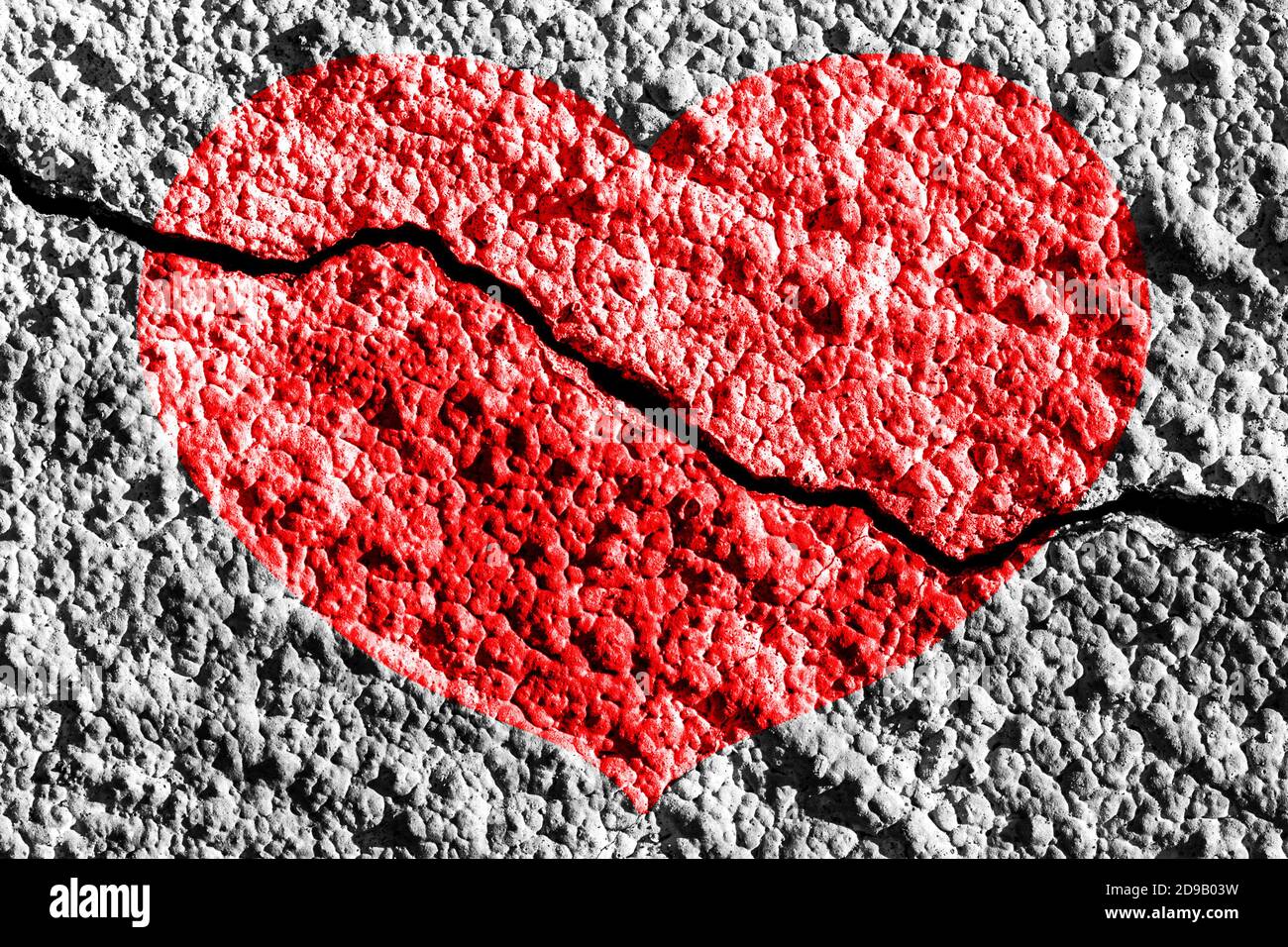 Red heart on a cracked texture. The concept of broken heart, end of ...