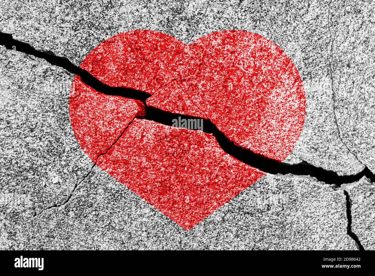 Red heart on a cracked texture. The concept of broken heart, end of ...