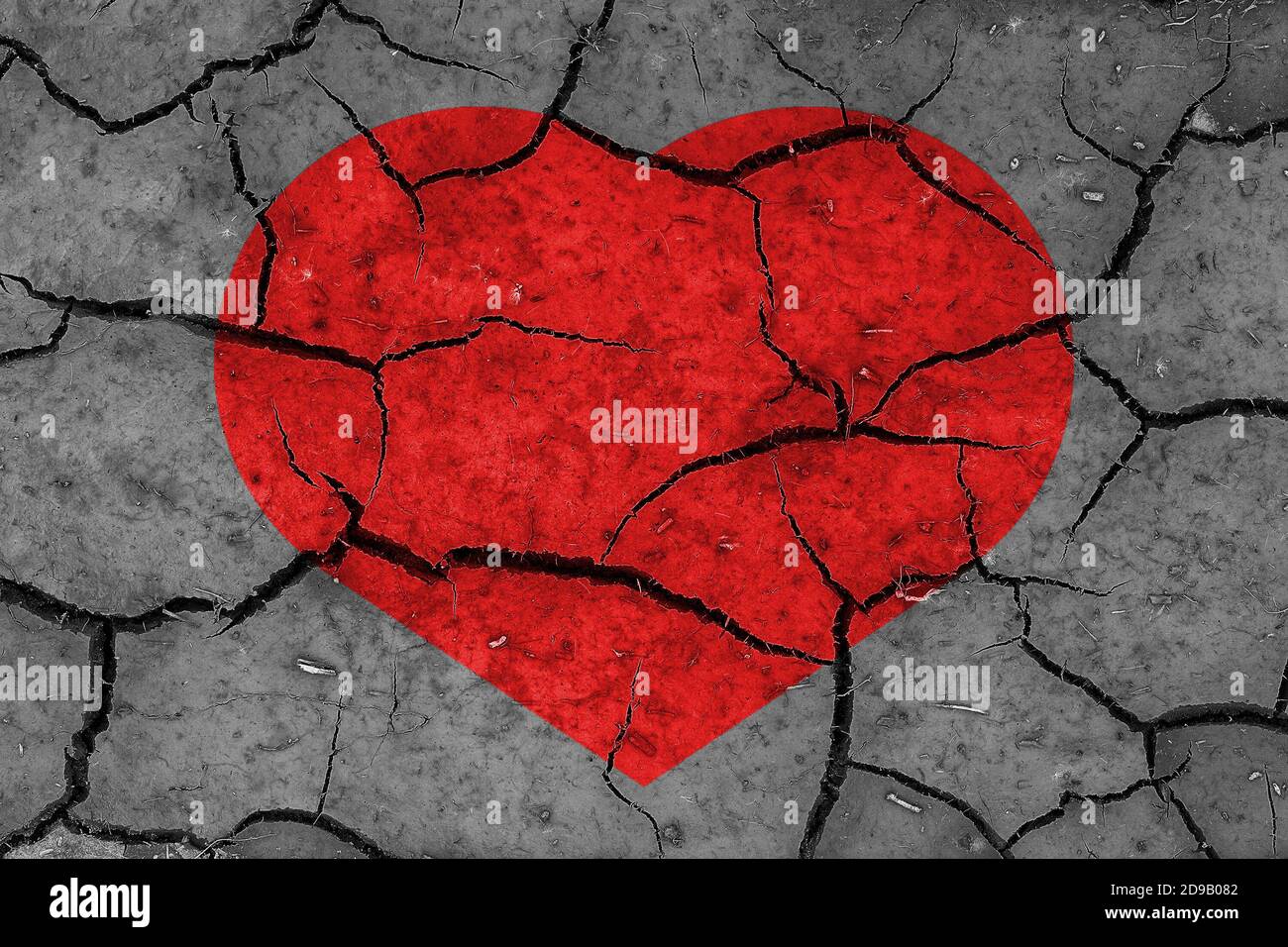 Red heart on a cracked texture. The concept of broken heart, end of ...