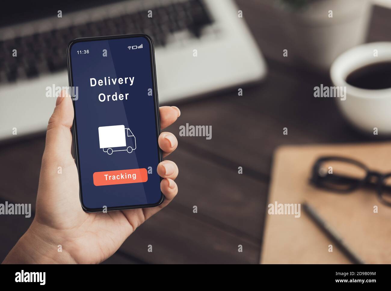 Modern devices, purchase and delivery. Woman at workplace at home ...