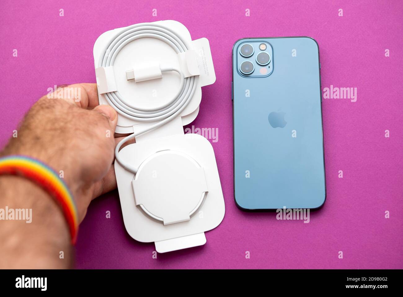 Paris, France - Nov 2, 2020: Male hand holding next to iPhone 12 Pro ...