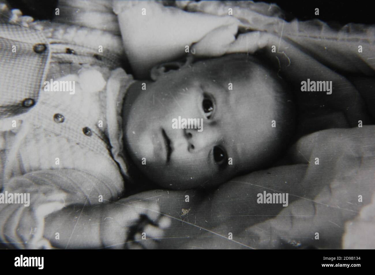 Fine 1970s vintage black and white photography of a small baby laying ...
