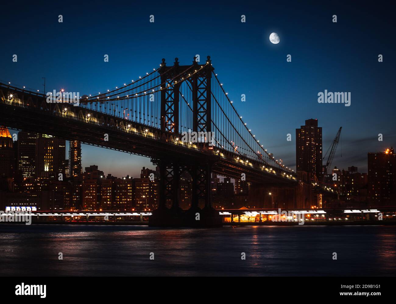 Moon over Manhattan. Silhouette of Manhattan Bridge and Manhattan ...
