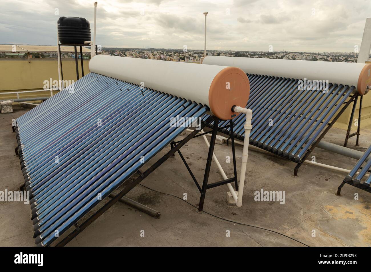 solar panels and tubes installed on roof top of houses and buildings to ...