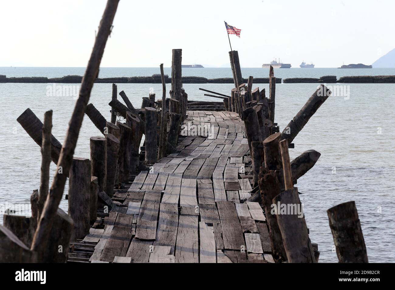 Old wood bridge to sea Stock Photo - Alamy