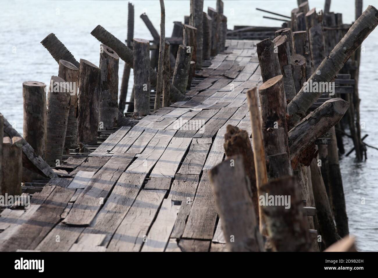Old wood bridge to sea Stock Photo - Alamy