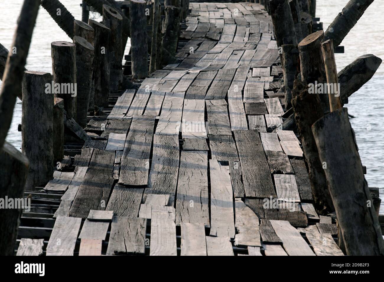 Old wood bridge to sea Stock Photo - Alamy