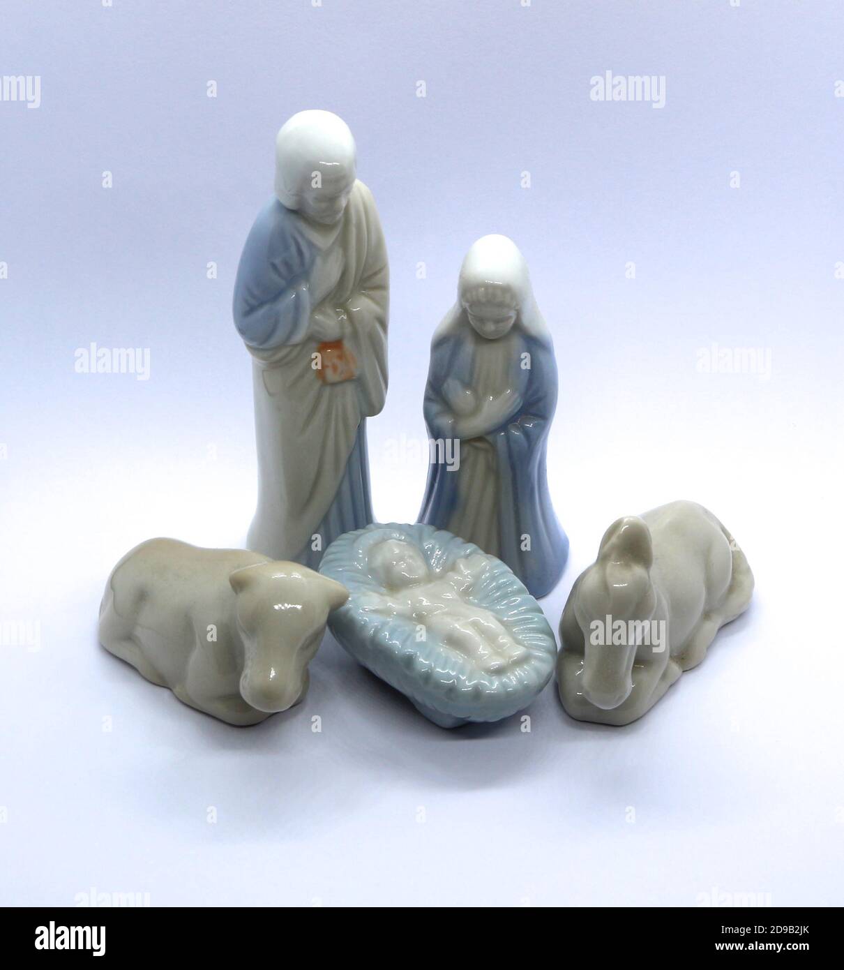 Porcelain nativity scene in pale blue and cream colours against a white ...