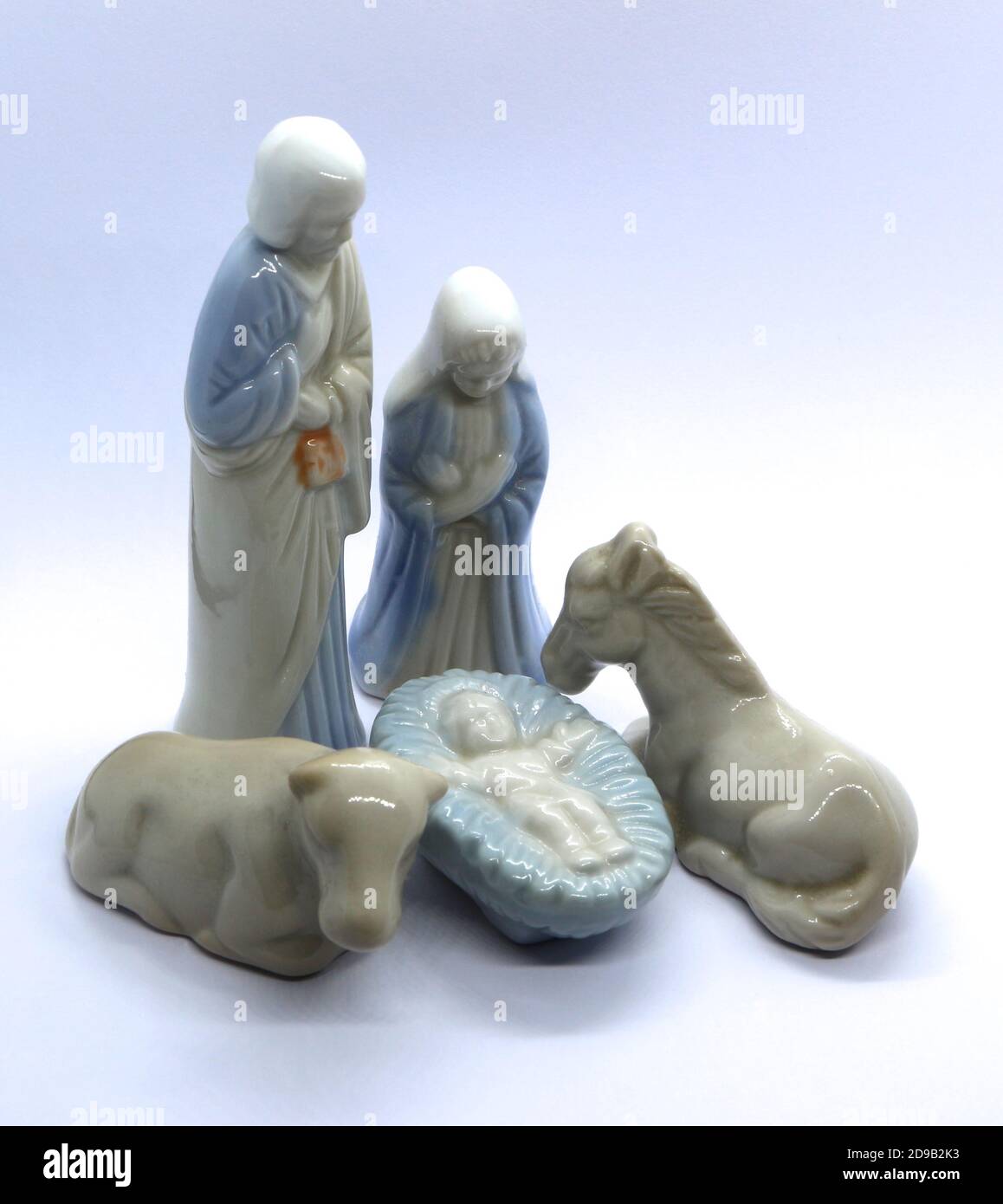 Porcelain nativity scene in pale blue and cream colours against a white ...