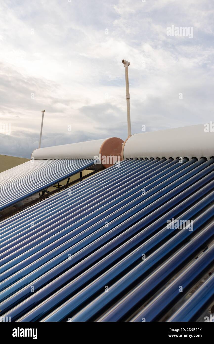 solar panels and tubes installed on roof top of houses and buildings to ...