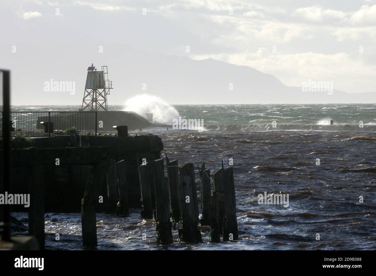 Ayr, Ayrshire, Scotland, UK. Waves crash over a seawall as spring high ...