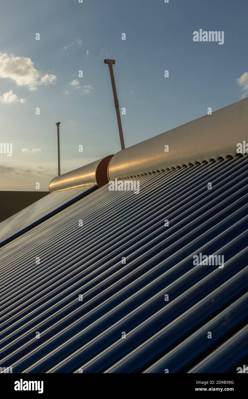 solar panels and tubes installed for heating water on roof tops of ...
