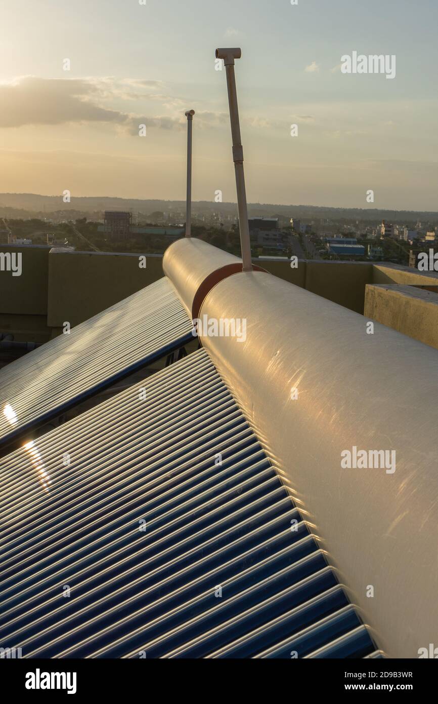 solar panels and tubes installed on roof top of houses and buildings to ...