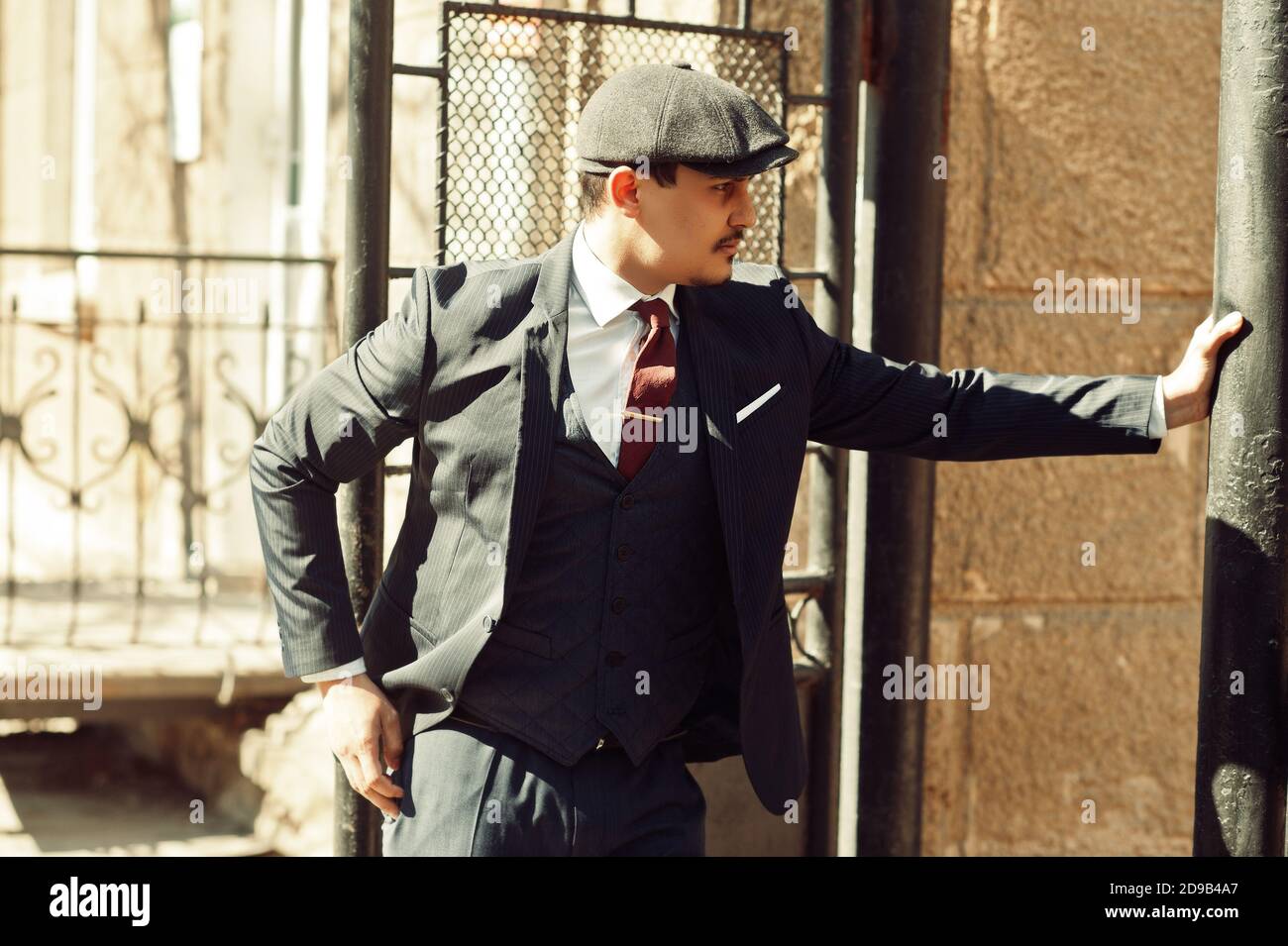Portrait of retro 1920s english arabian business man wearing dark suit ...
