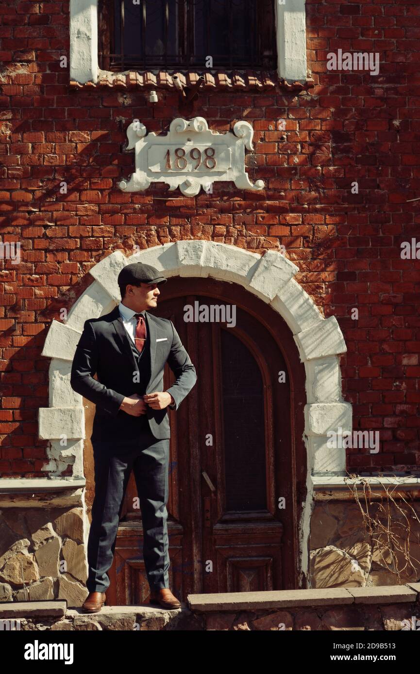 Portrait of retro 1920s english arabian business man wearing dark suit ...