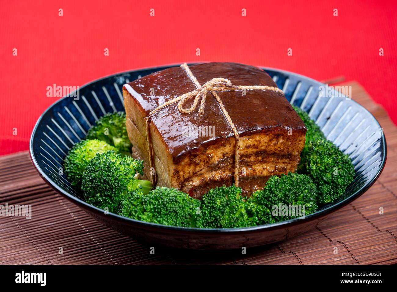 Dong Po Rou (Dongpo pork meat) in a beautiful blue plate with green ...