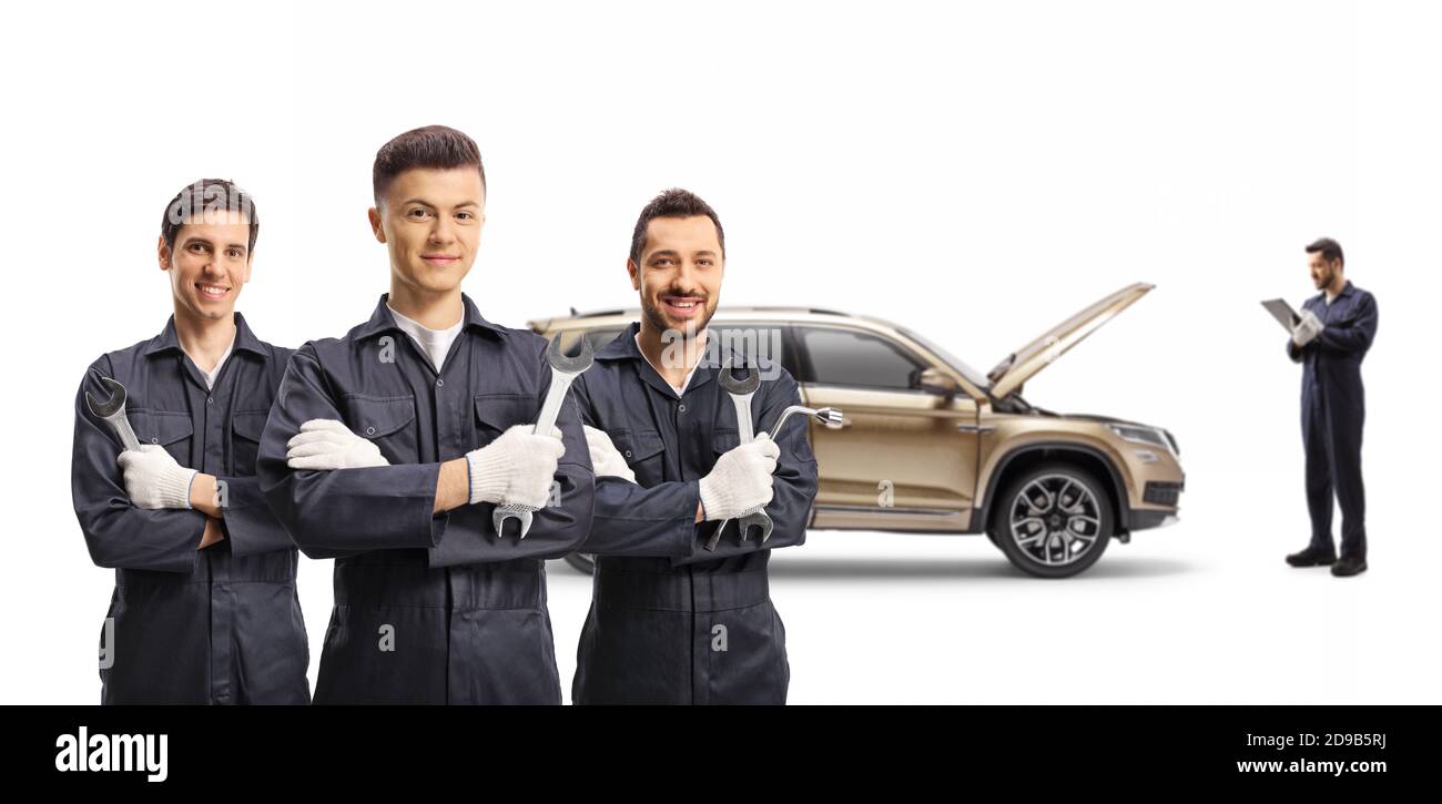 Team of auto mechanic workers with a SUV isolated on white background ...