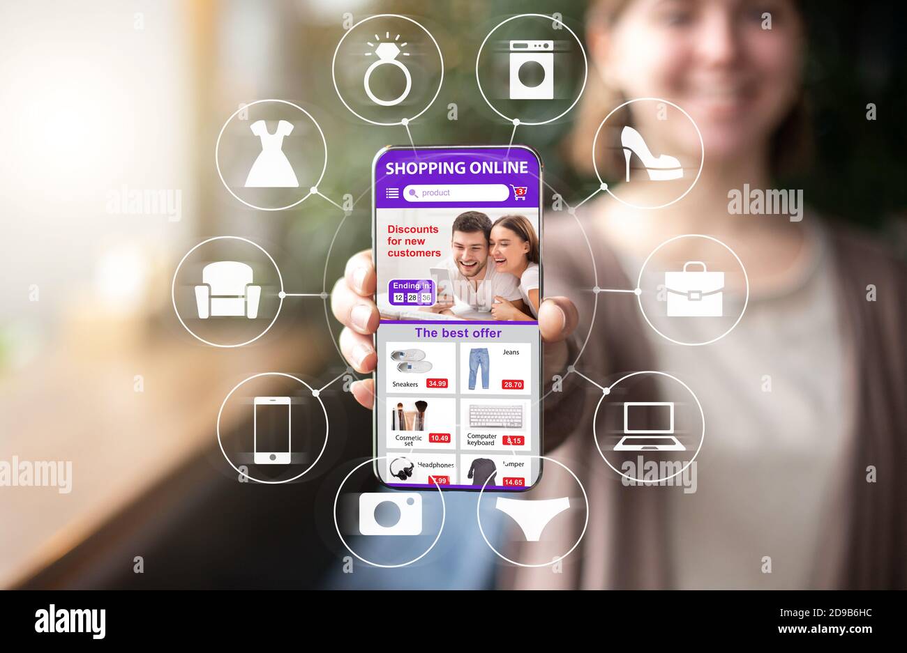 Online shopping. Young woman holding smartphone with clothing store ...