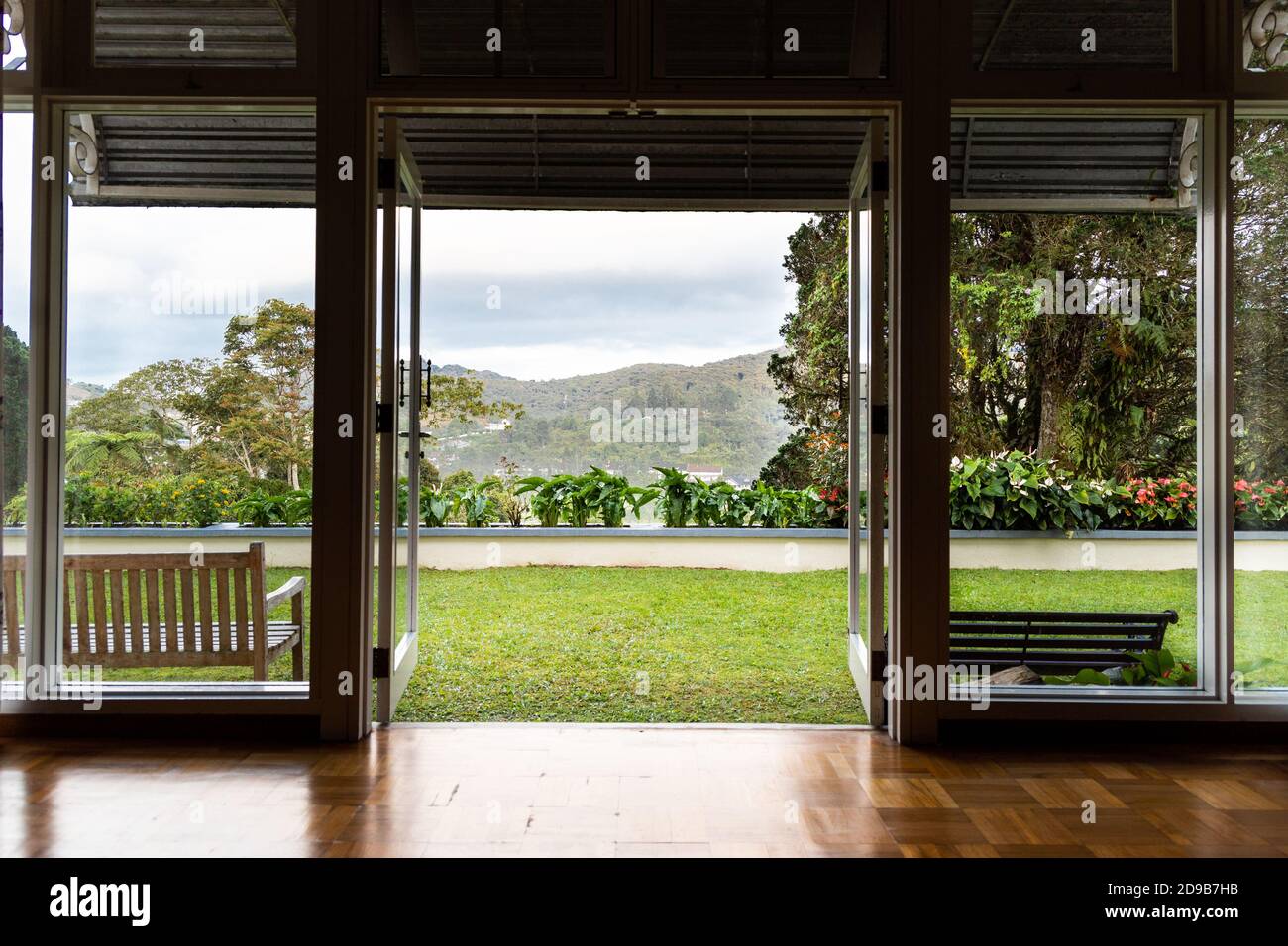 Glass door opening to refreshing, green, nature landscape scenic view ...