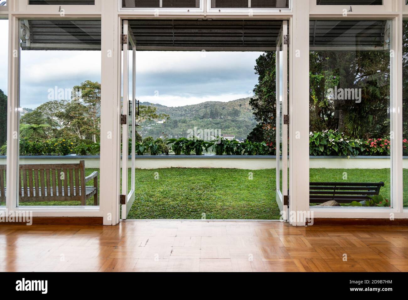 Glass door opening to refreshing, green, nature landscape scenic view ...