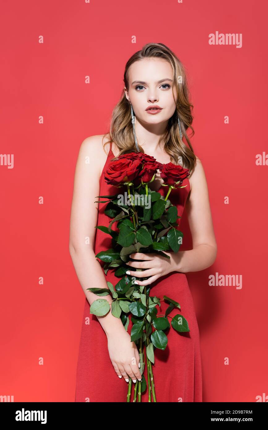 Woman bouquet roses looking at camera hi-res stock photography and ...