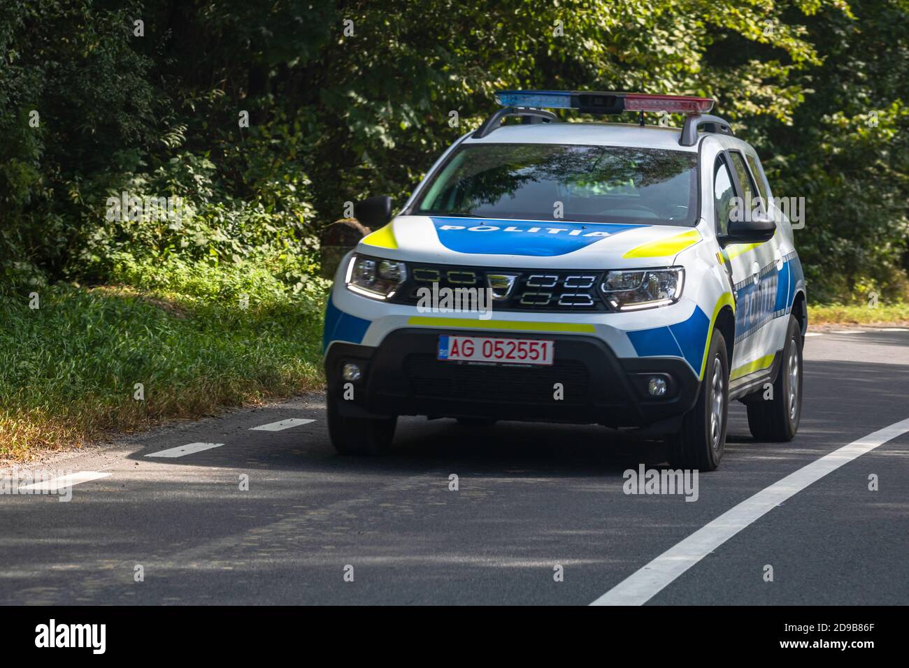 Romanian Police new Dacia Duster car in motion on asphalt road, front ...