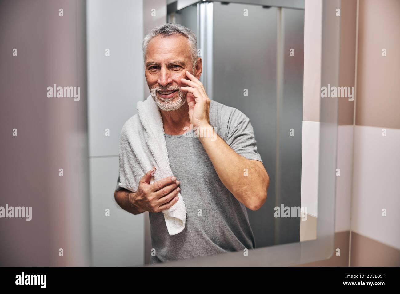 Joyful elderly man posing during his morning routine Stock Photo - Alamy