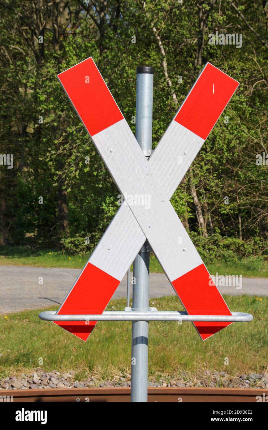 Vertical shot of andreas cross at a rail crossing Stock Photo - Alamy