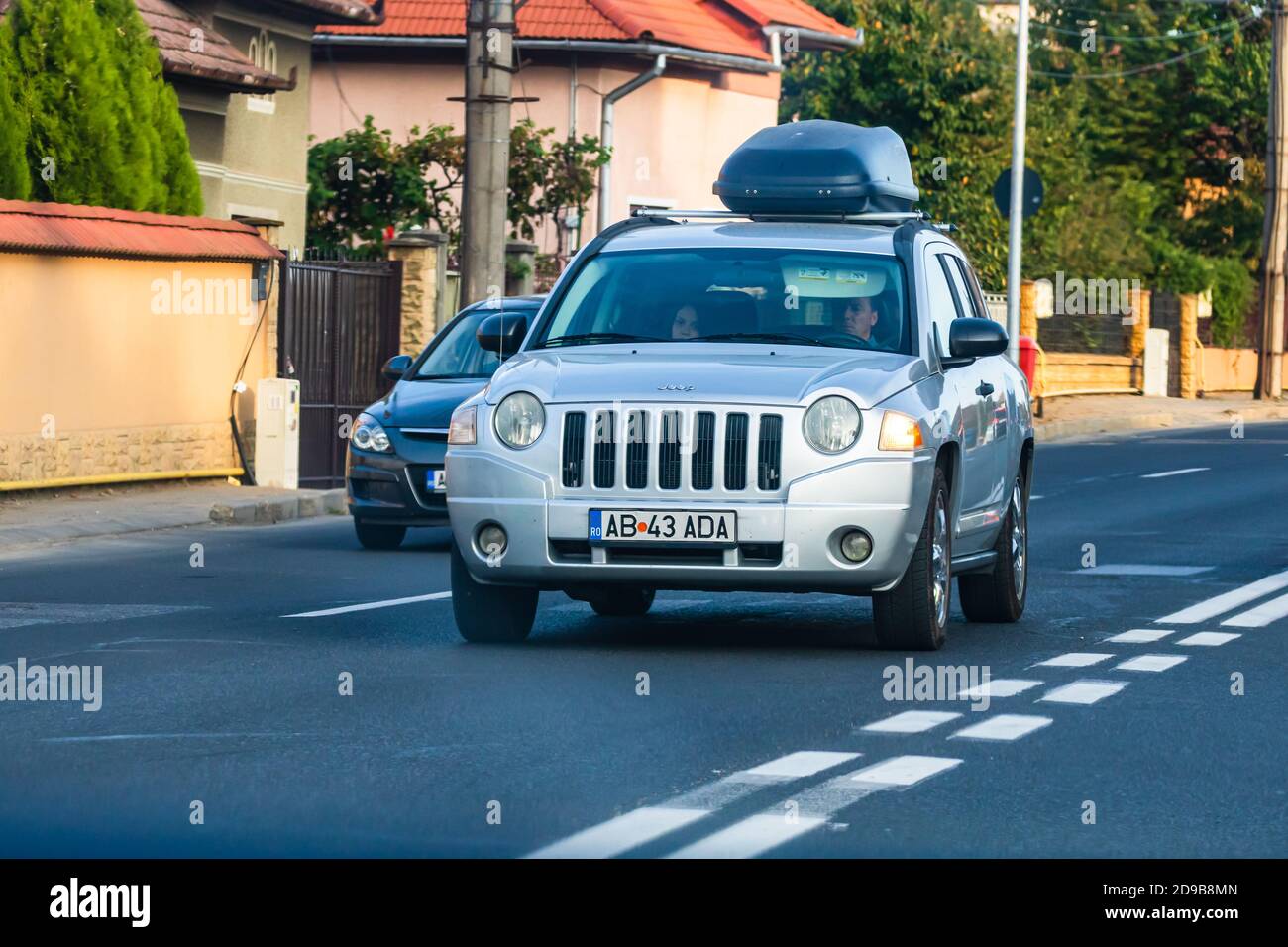 Traveling JEEP car in motion on asphalt road, front view of car on ...