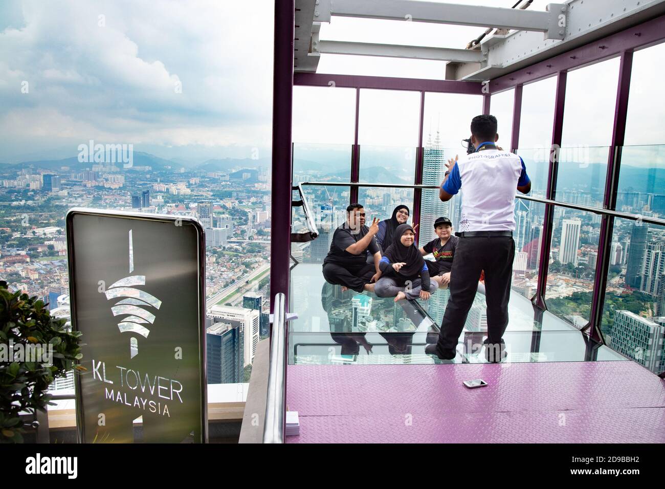 Visitors taking photo at the KL Tower Skybox, on Skydeck. KL Tower is ...