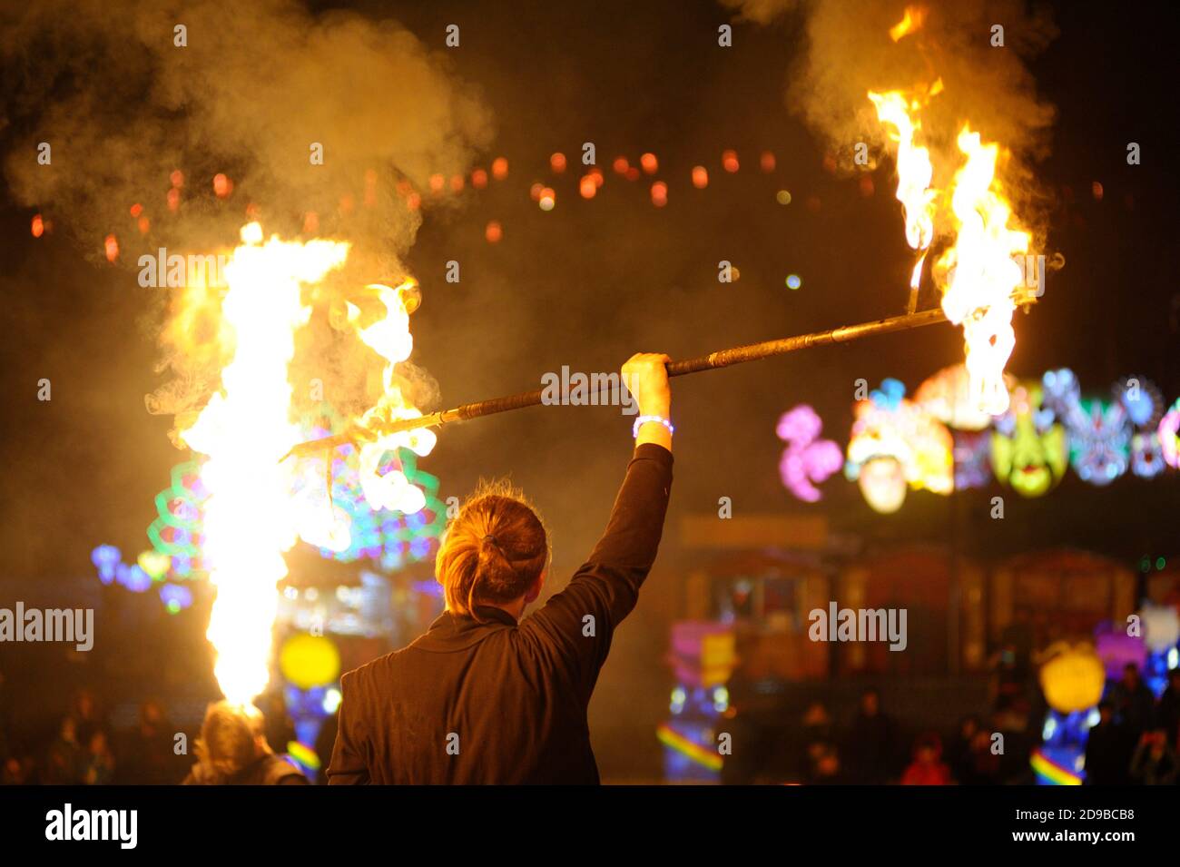 Fire juggler performing at night on the stage Stock Photo - Alamy