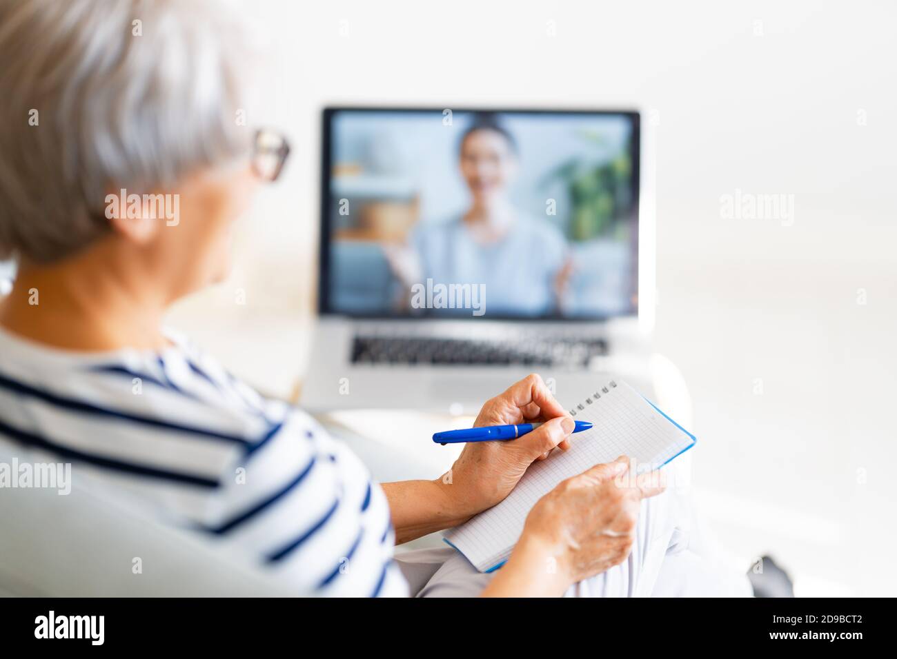 Senior woman is using laptop pc for remote conversation, work or ...