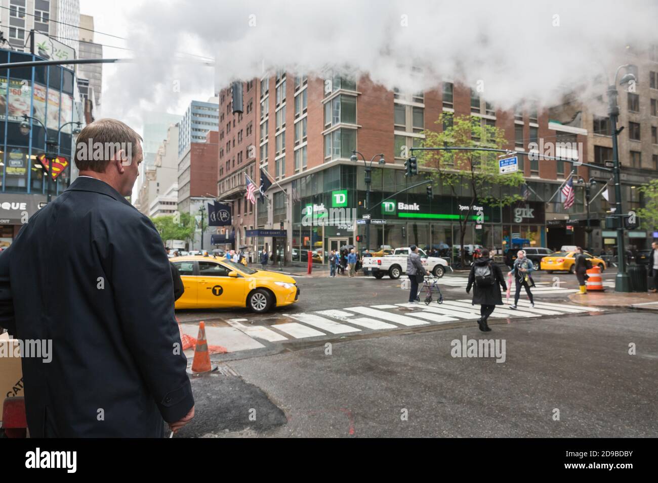 NEW YORK, USA - May 03, 2016: Manhattan street scene. Cloud of vapor ...