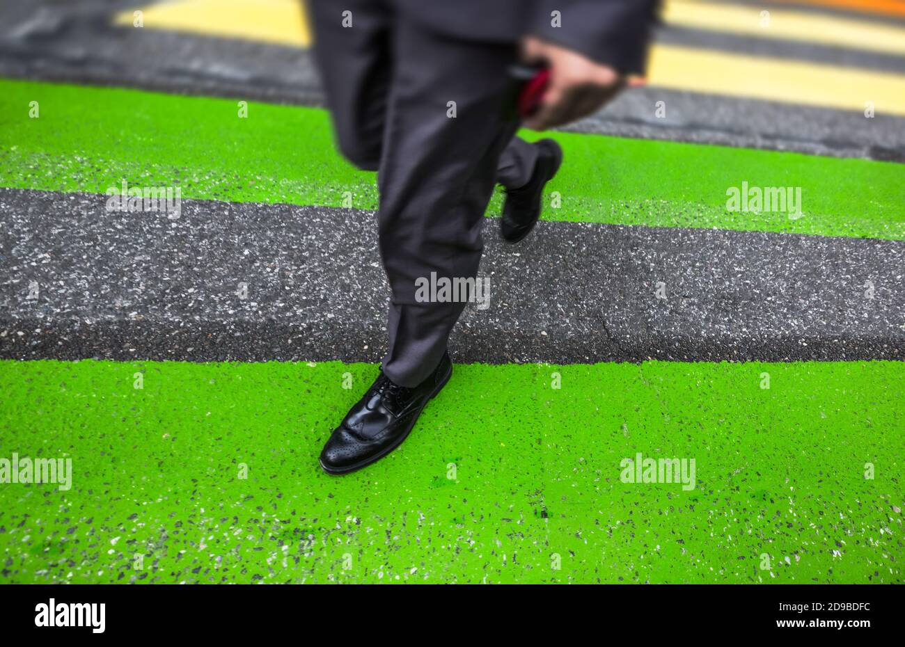 Zebra crossing. Man cross street at crosswalk in the city Stock Photo ...