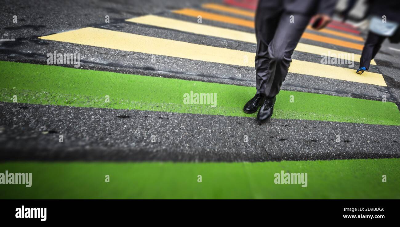 Zebra crossing. Man cross street at crosswalk in the city Stock Photo ...