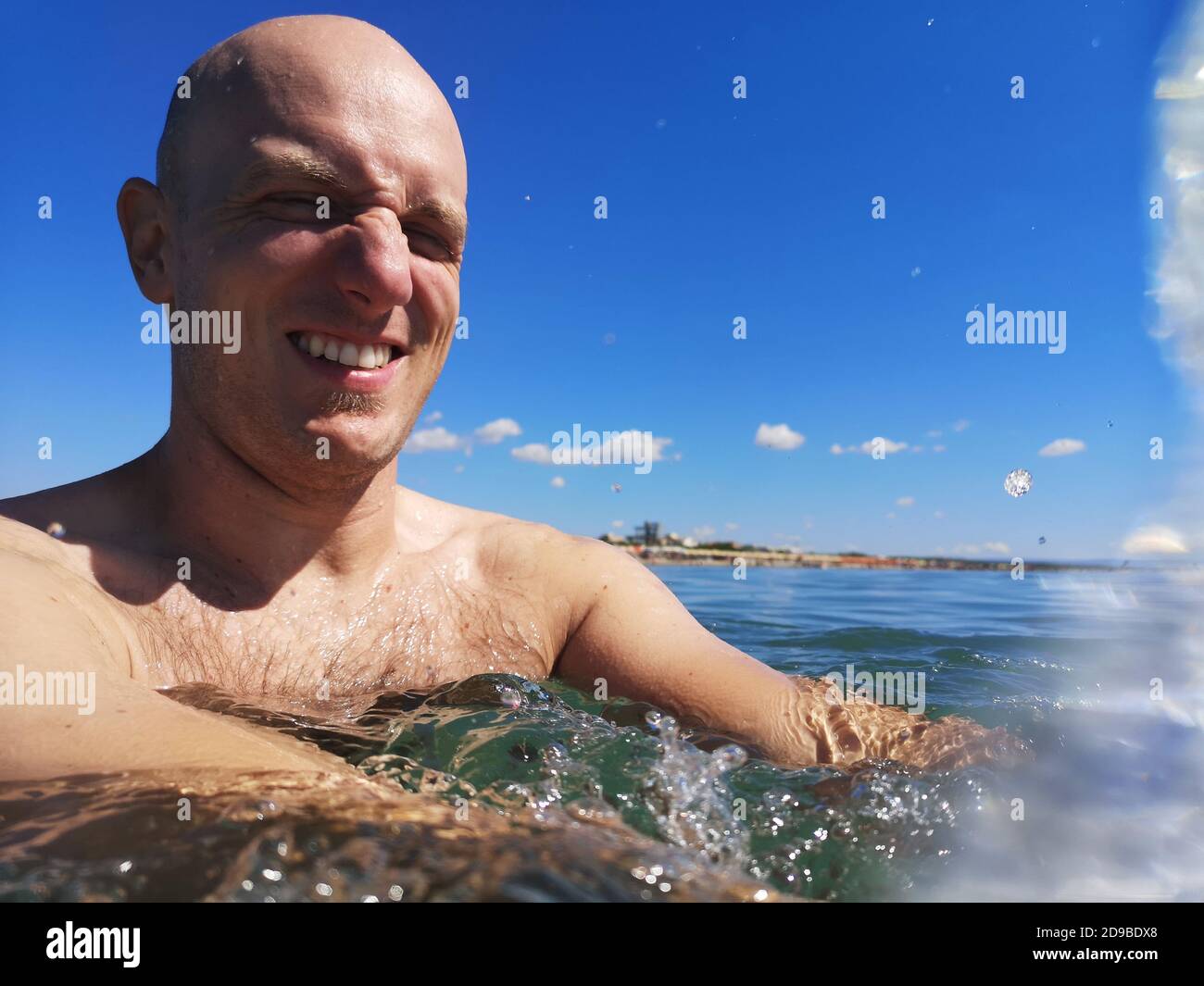 Bald man swimming hi-res stock photography and images - Alamy