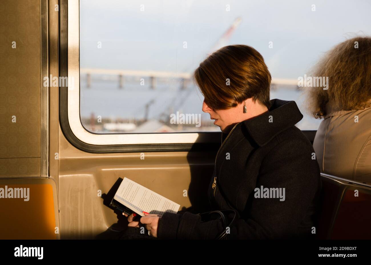 NEW YORK, USA - Apr 28, 2016: Girl reading a book in the New York ...