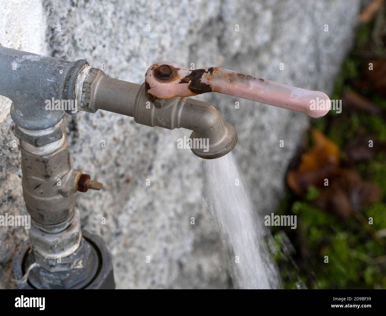 open outdoor water tap spreading macro detail Stock Photo - Alamy