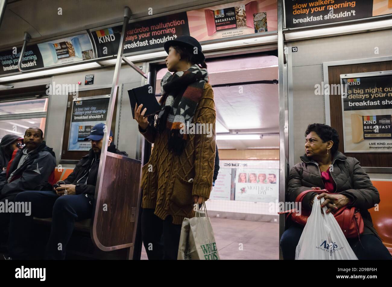 NEW YORK, USA - May 01, 2016: Group of black passengers in the carriage ...