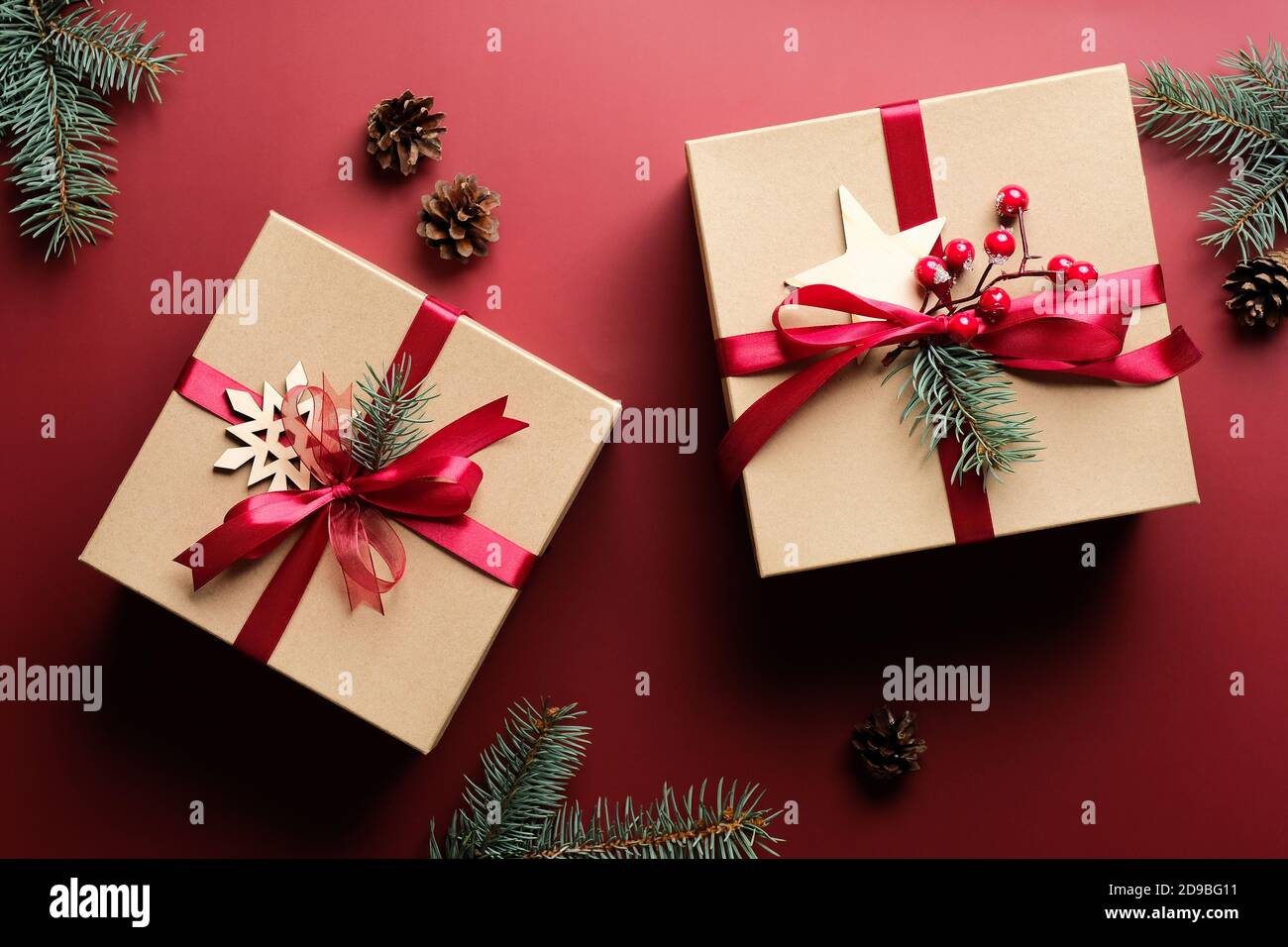 Vintage Christmas gift boxes decorated red ribbon bow and fir branches ...