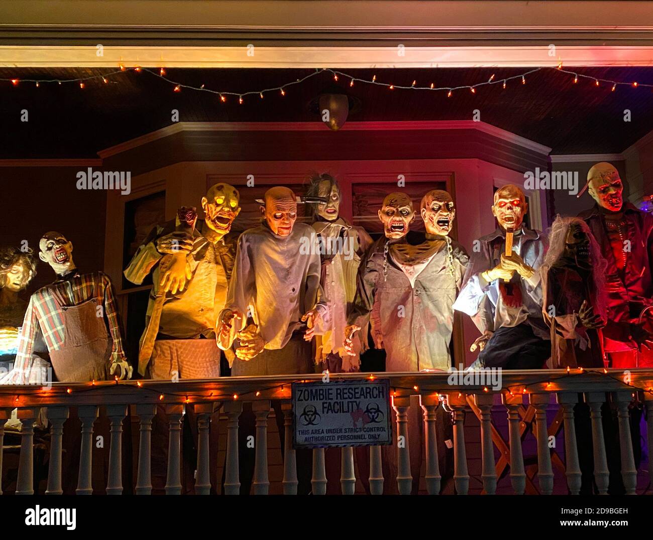 Scary Halloween installation on the porch of a large victorian house in ...