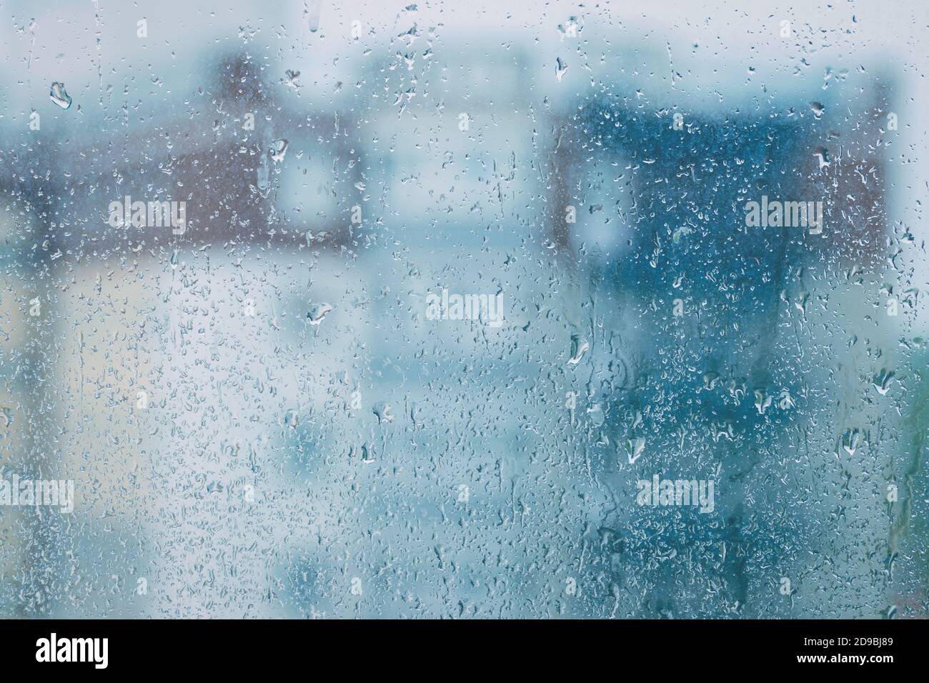 View through a rainy window on a blurred house. Bad rainy weather Stock ...