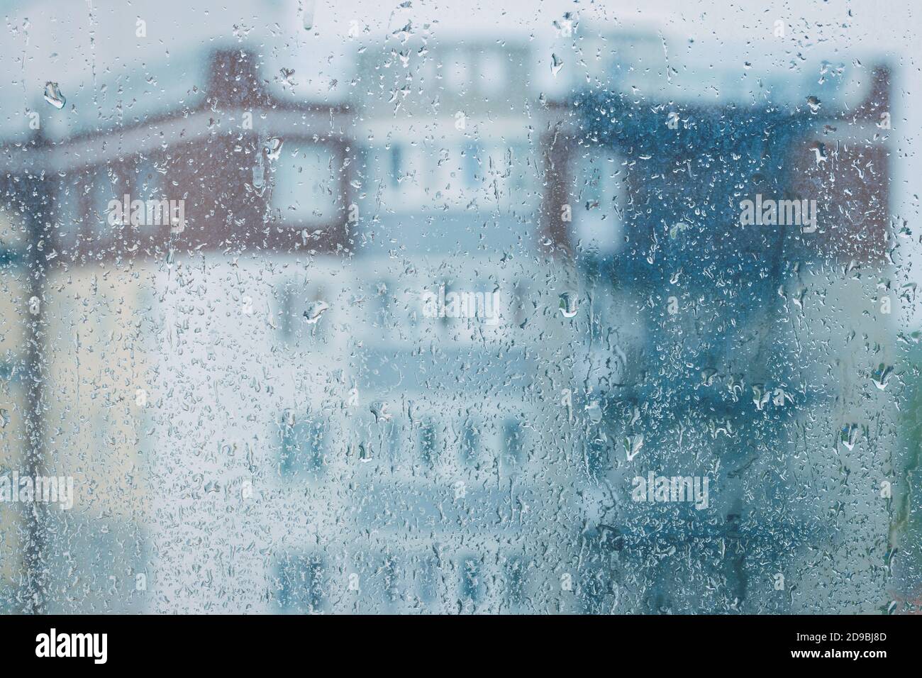 View through a rainy window on a blurred house. Bad rainy weather Stock ...