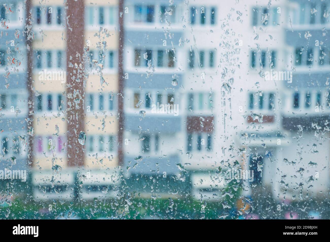 View through a rainy window on a blurred house. Bad rainy weather Stock ...