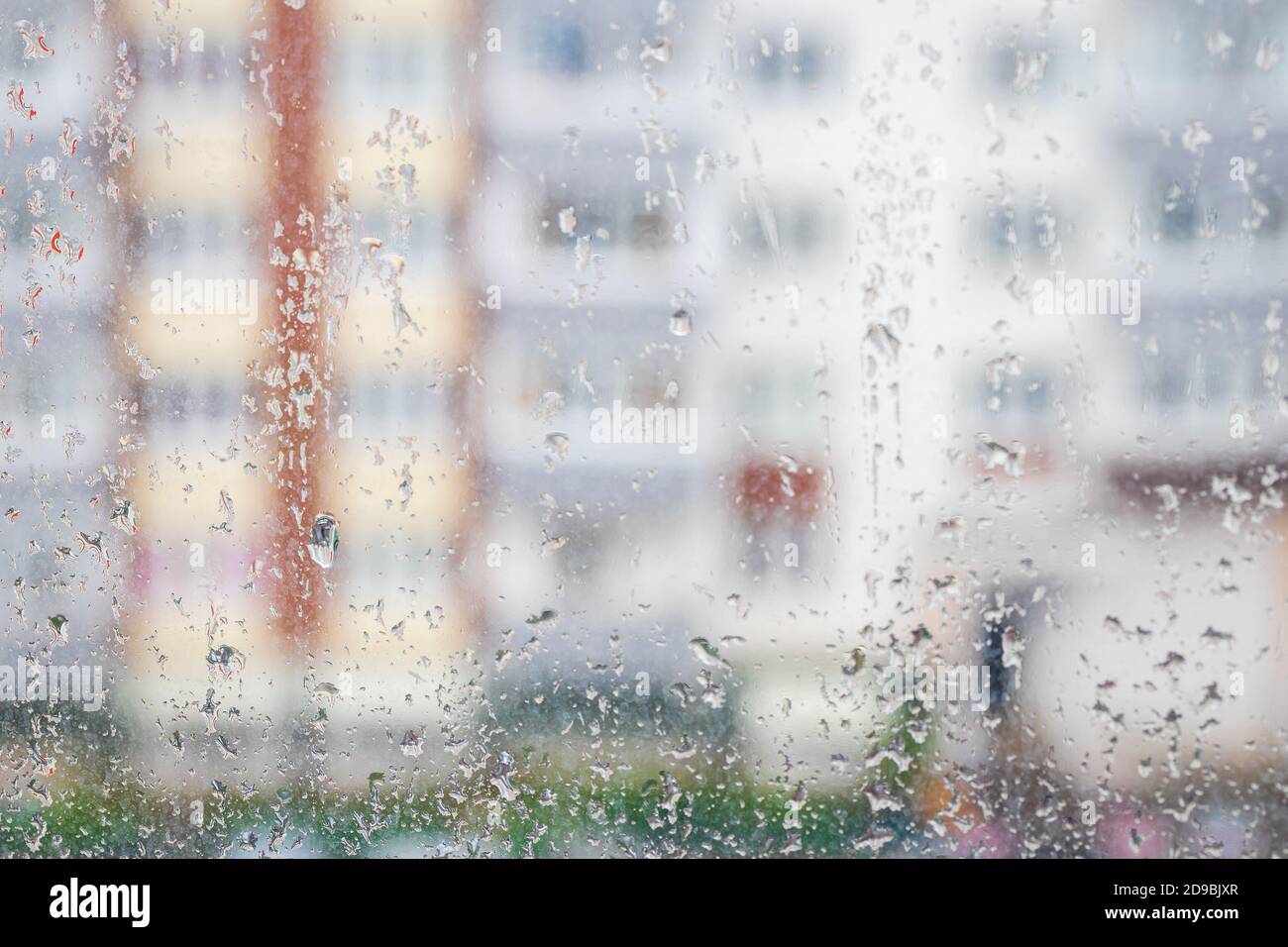 View through a rainy window on a blurred house. Bad rainy weather Stock ...