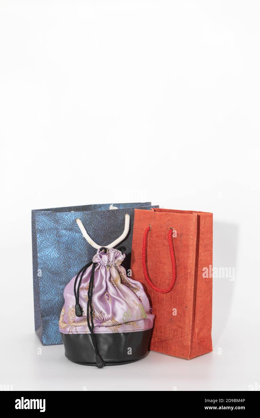 Colorful paper bags and gift boxes and pouch Stock Photo - Alamy