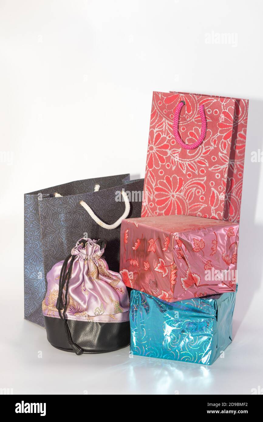 Colorful paper bags and gift boxes and pouch Stock Photo - Alamy