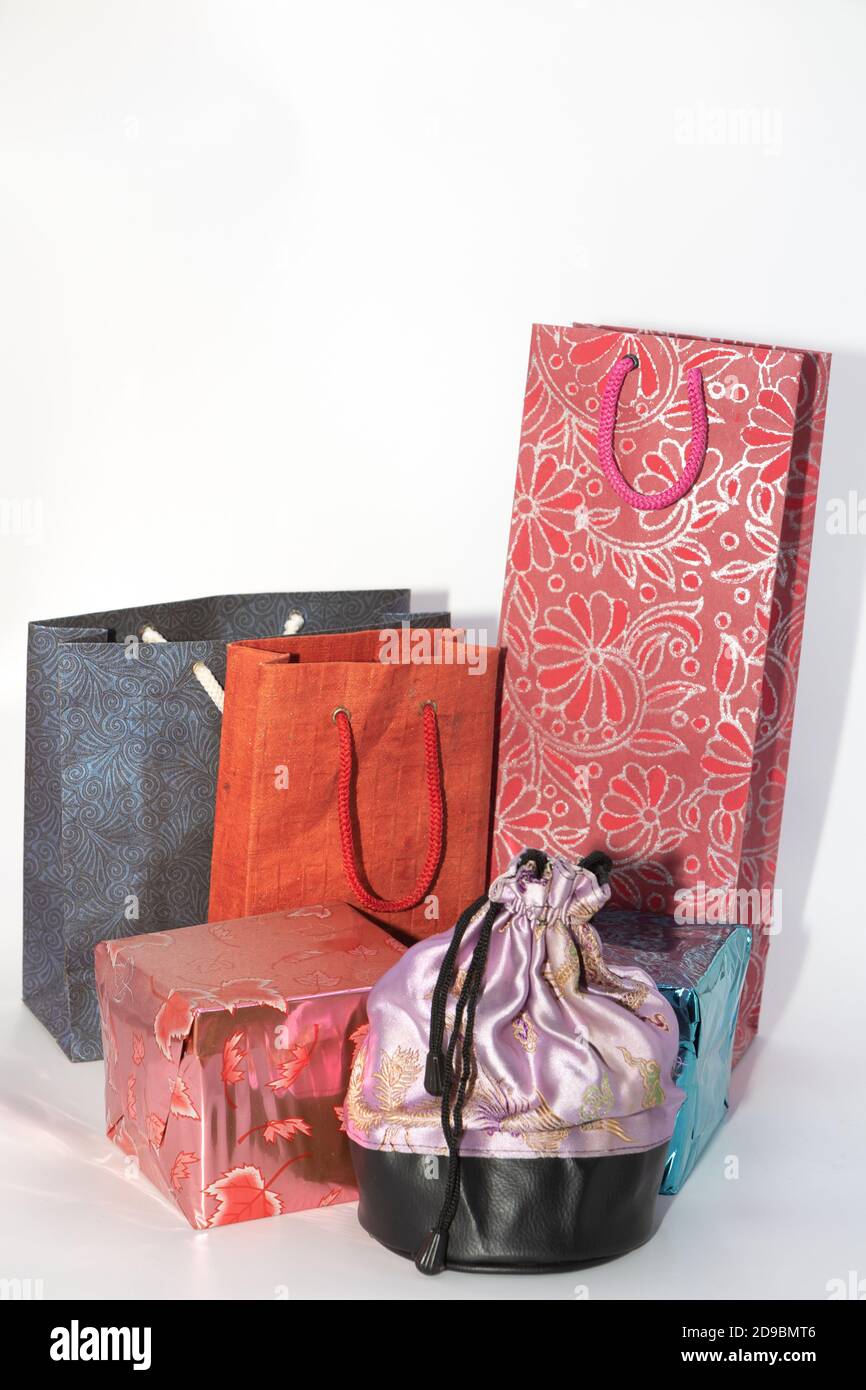 Colorful paper bags and gift boxes and pouch Stock Photo - Alamy