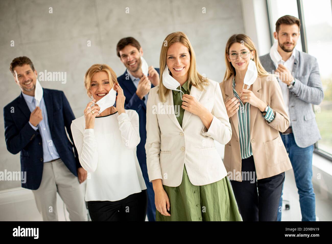 Business team taking off face hi-res stock photography and images - Alamy