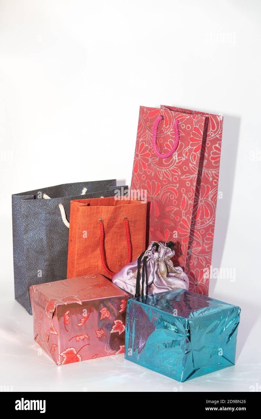 Colorful paper bags and gift boxes and pouch Stock Photo - Alamy